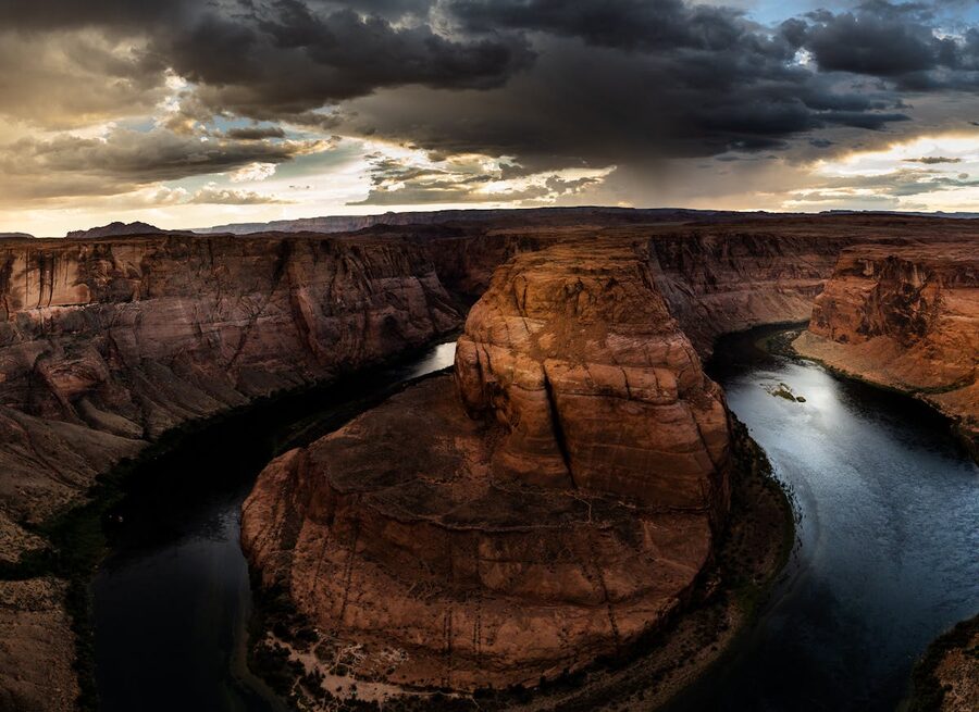 Horseshoe Bend at sunset with dramatic clouds over Arizona