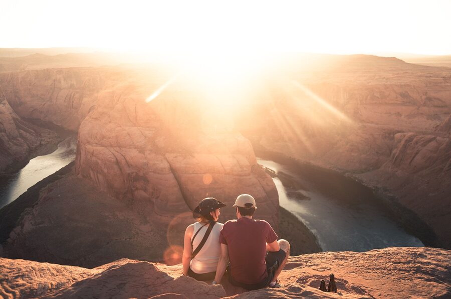 Couple at canyon viewpoint during sunrise in Arizona