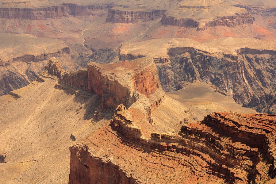 Dramatic aerial view of Grand Canyon cliffs and rock layers