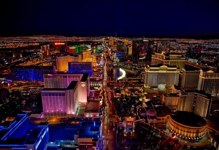 Las Vegas Strip glowing at night from aerial view