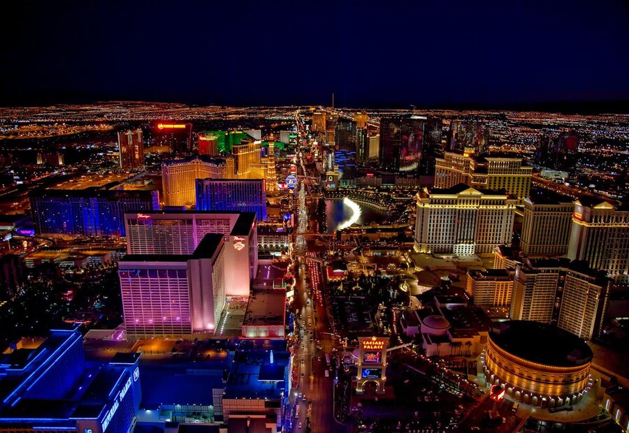 Las Vegas Strip glowing at night from aerial view