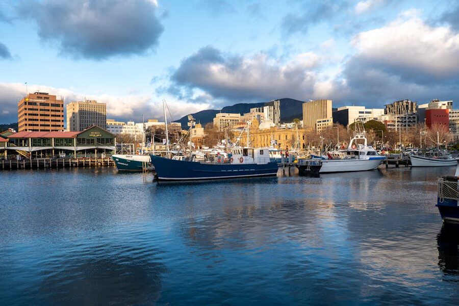 Hobart waterfront in early morning light with boats and city skyline Tasmania