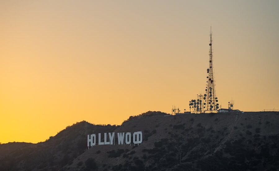 Hollywood Sign at sunset with Los Angeles skyline in silhouette
