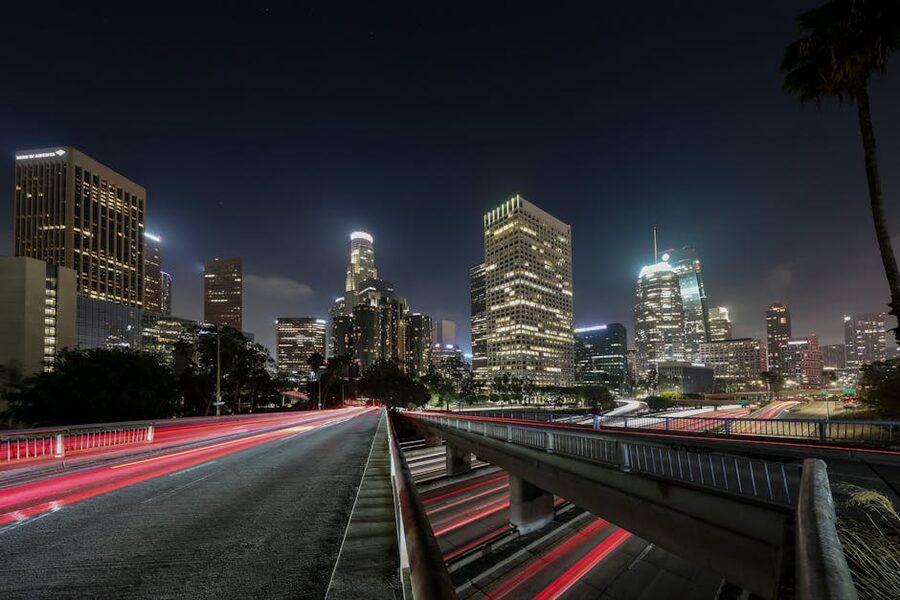 Downtown Los Angeles skyline at night with light trails