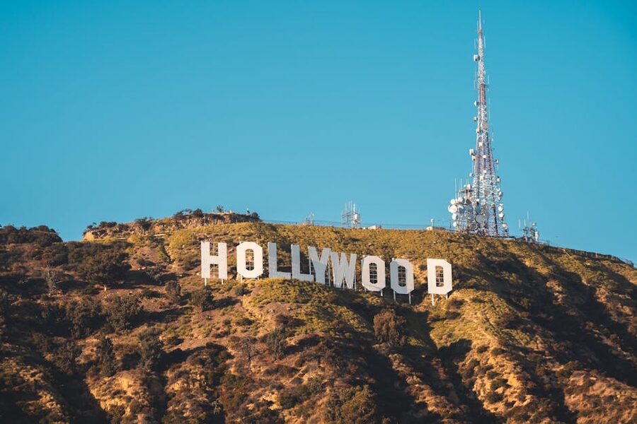 The Hollywood Sign on a hillside in Los Angeles under a blue sky