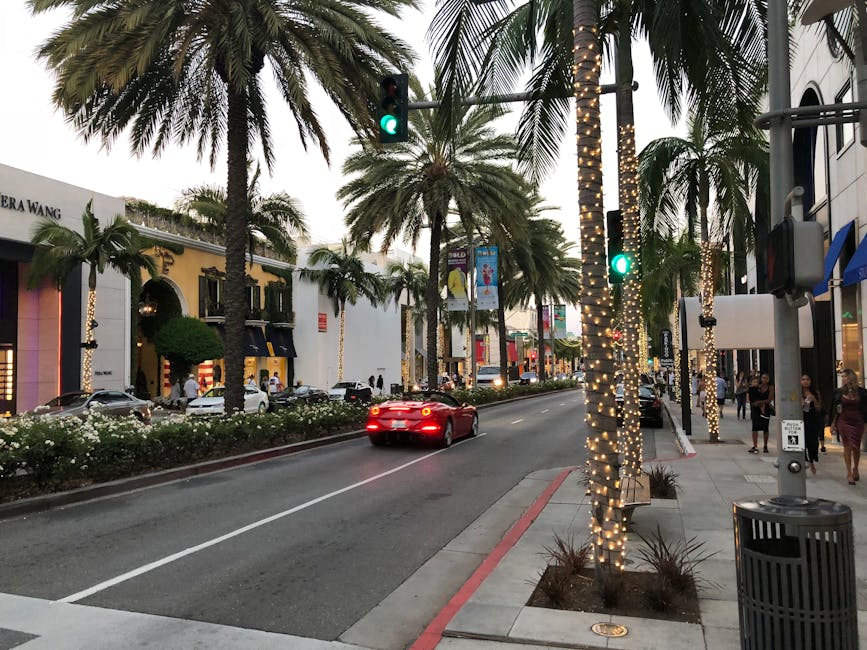 Rodeo Drive at dusk with palm trees and luxury storefronts