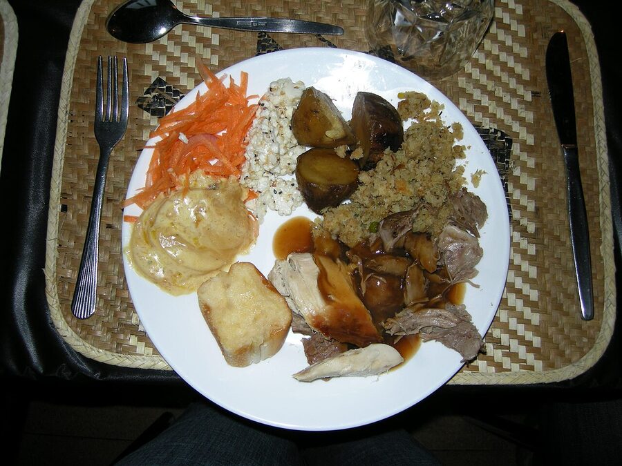 Hangi dinner buffet plate with lamb chicken and root vegetables at Mitai Maori Village