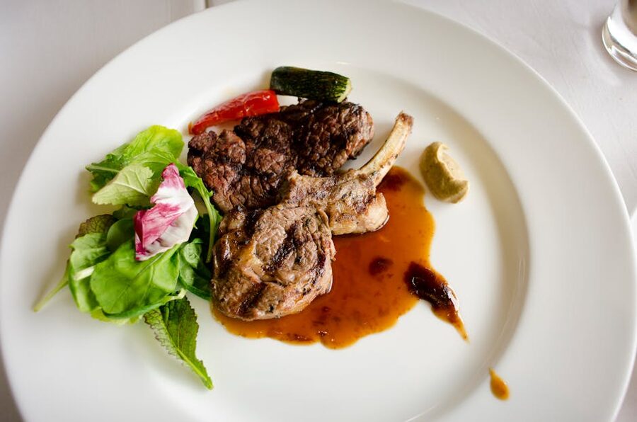 Lamb dinner plate with vegetables similar to Mitai hangi buffet serving