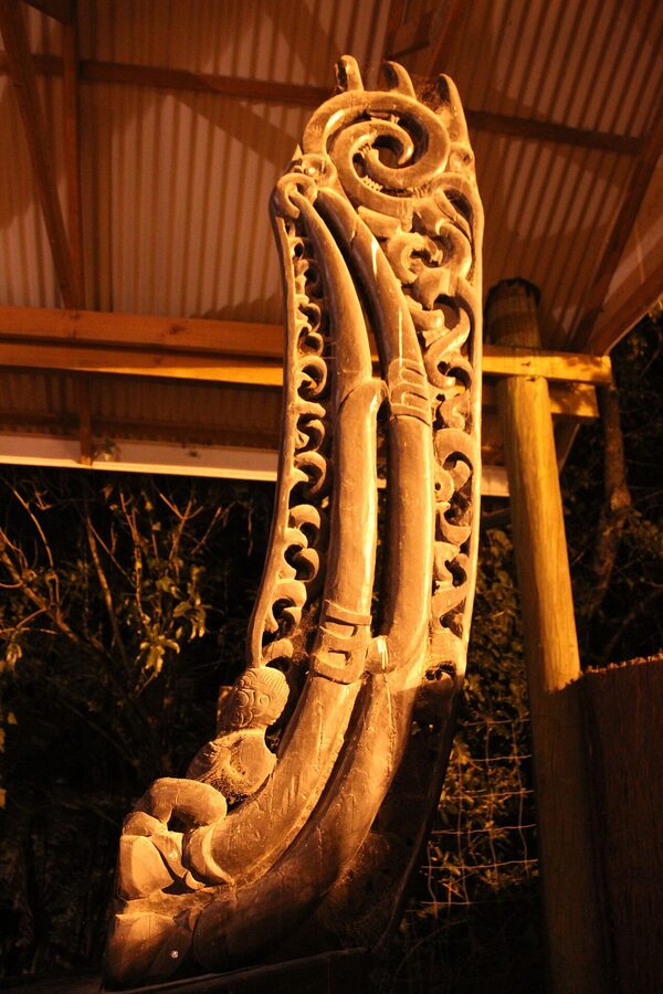 Carved Maori war canoe detail at Mitai Village