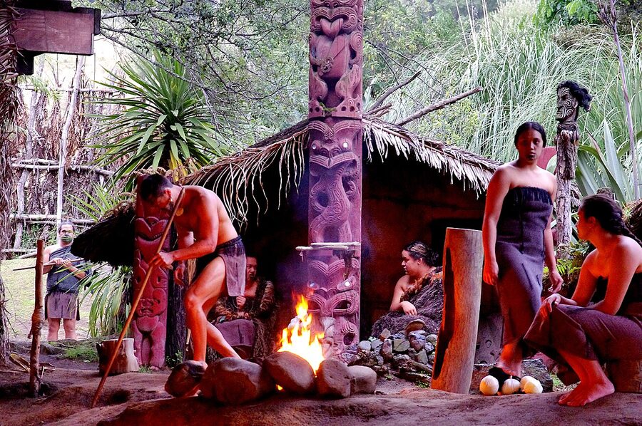 Maori warriors performing on stage at Mitai Maori Village Rotorua New Zealand