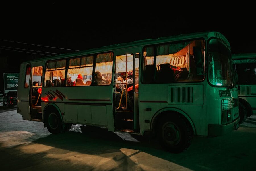 Evening shuttle bus with passengers heading to Mitai Maori Village Rotorua