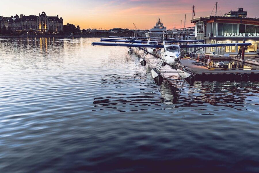 Harbour Air seaplane docked at Victoria Inner Harbour at sunset