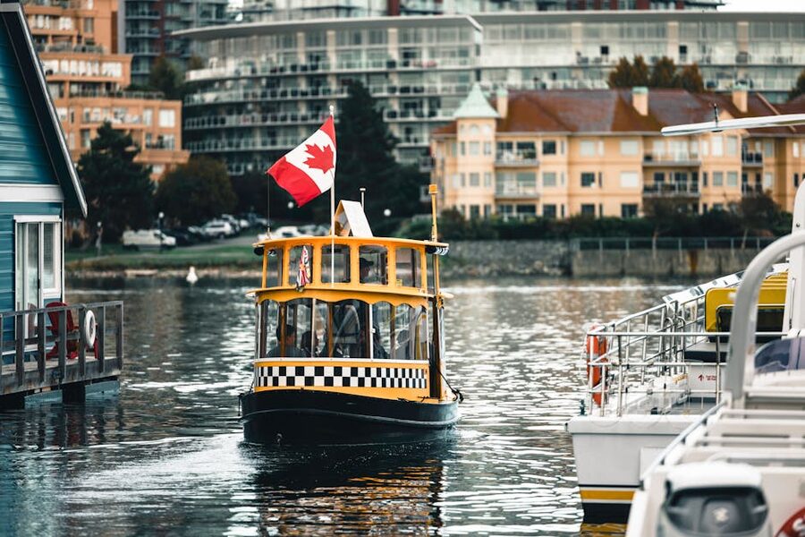 Yellow harbour ferry Victoria British Columbia Canadian flag