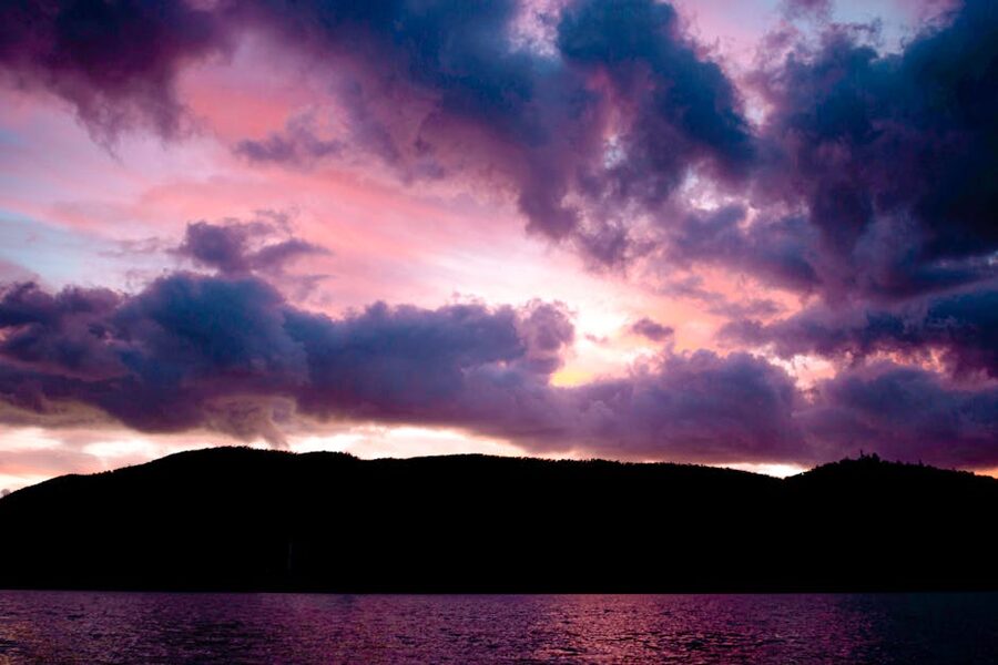 Sunset over mountains and water in the Whitsundays