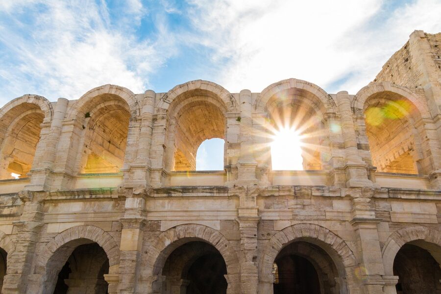 Arles amphitheatre arches backlit by the afternoon sun