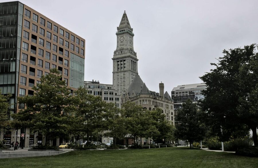 Boston Custom House Tower framed by greenery