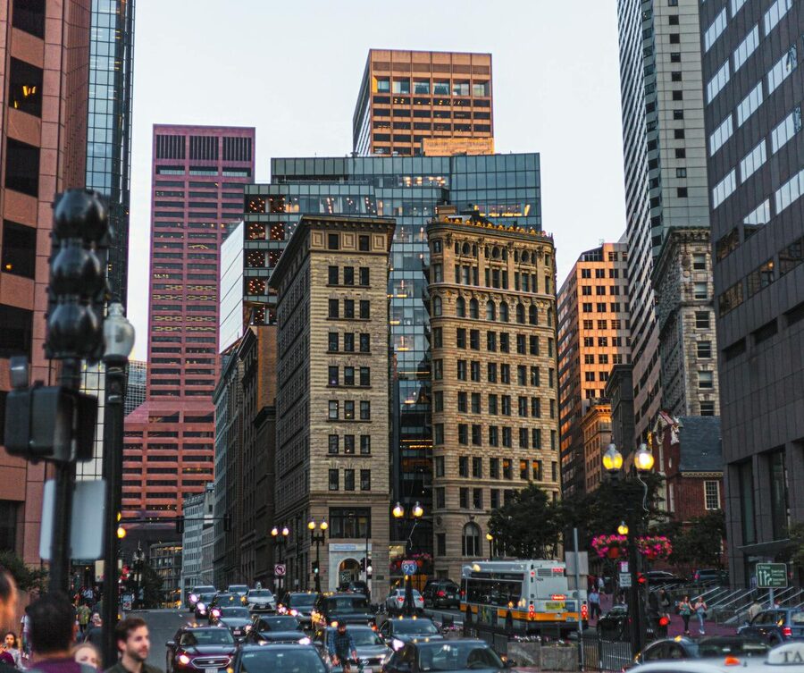 Busy downtown Boston street with modern skyscrapers
