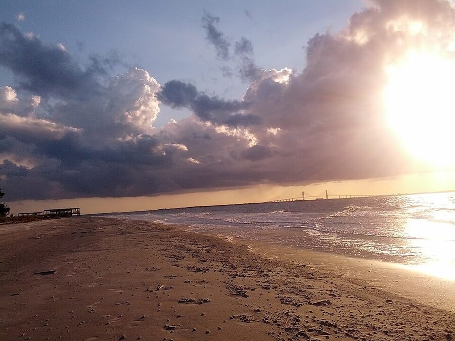 Jekyll Island beach with Sidney Lanier Bridge in the distance