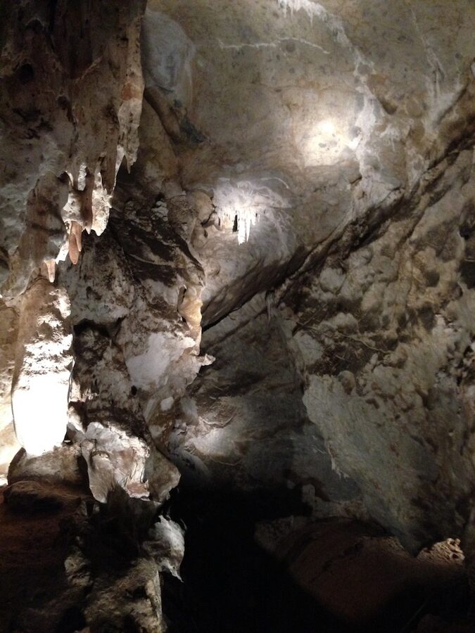 Grand Arch entrance at Jenolan Caves with stone walls and natural cathedral effect
