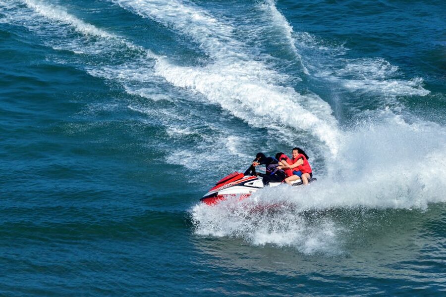 Group of riders on jet skis on open ocean