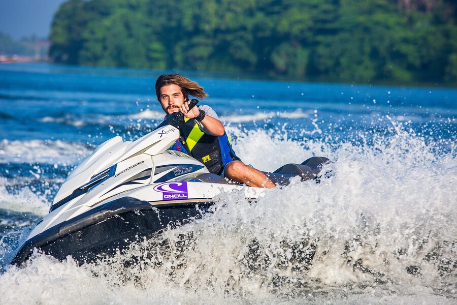 Jet ski rider with splash on the sea