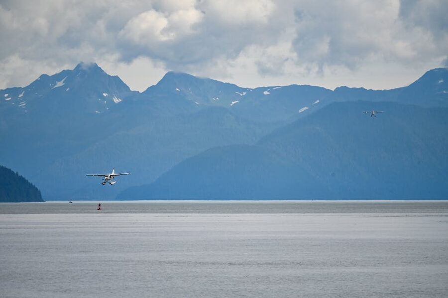 Seaplane landing in Juneau Alaska with mountains in the background