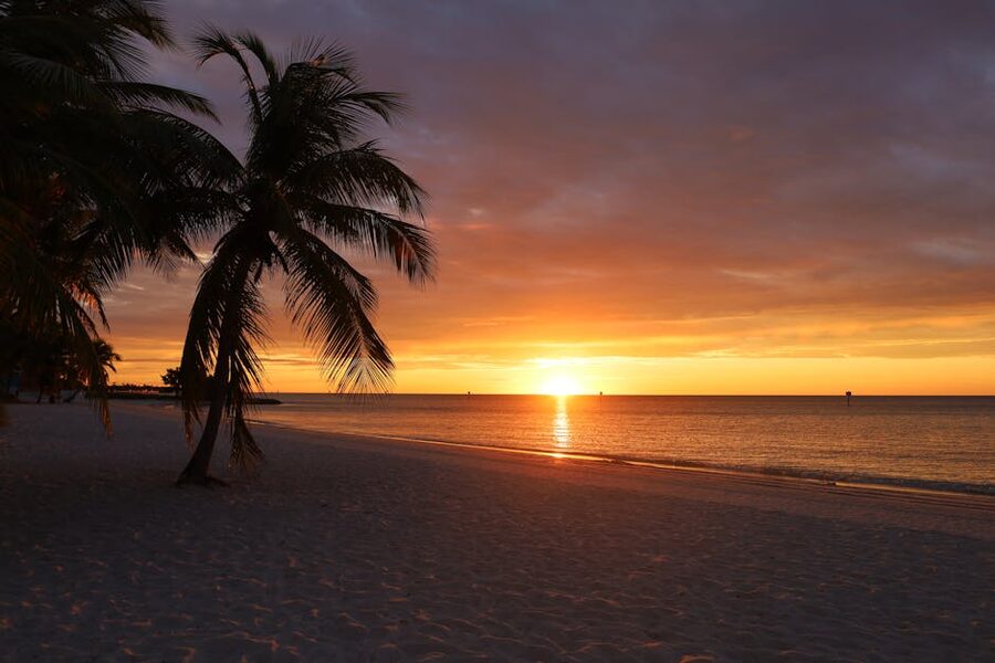 Sunset over the sea on a Key West sandy beach