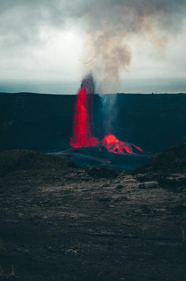 Kilauea Volcano erupting during twilight with red lava