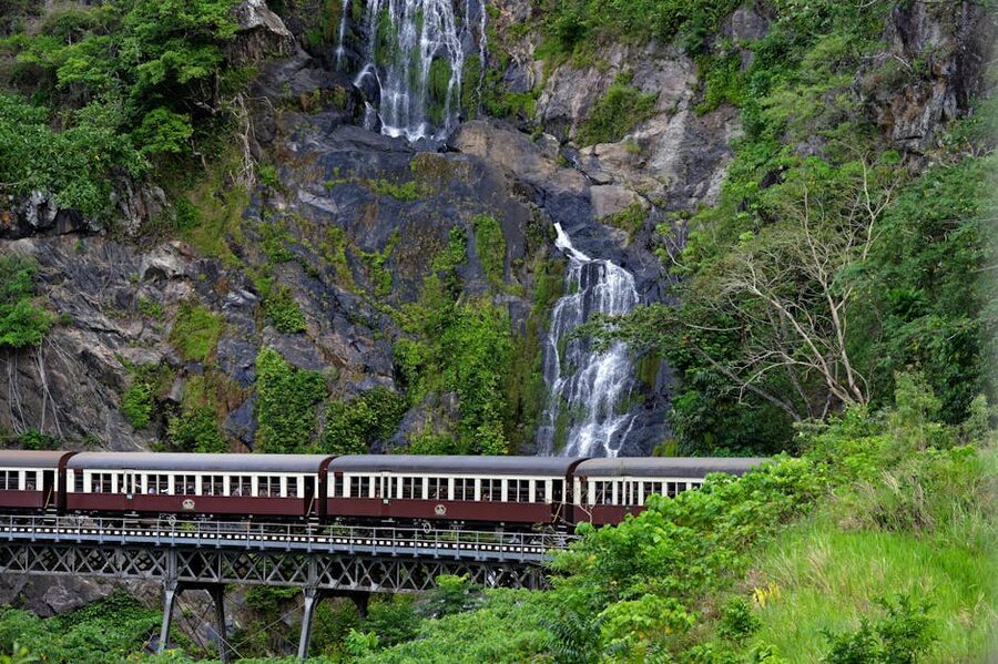 Vintage train crossing a bridge near Barron Falls Queensland