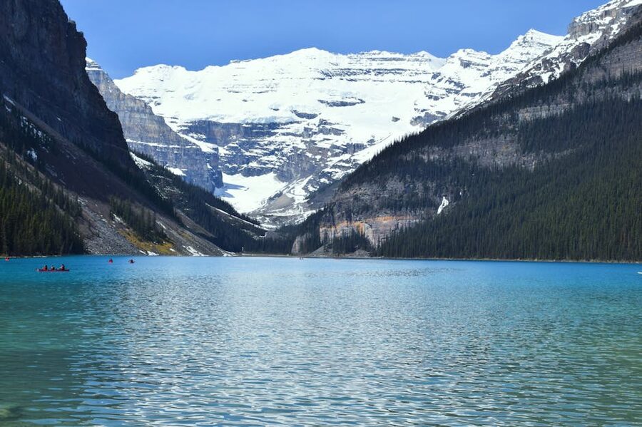 Lake Louise turquoise water with snowy peaks in the background