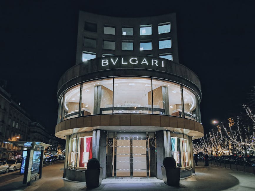 Illuminated luxury storefront on Champs-Elysees at night