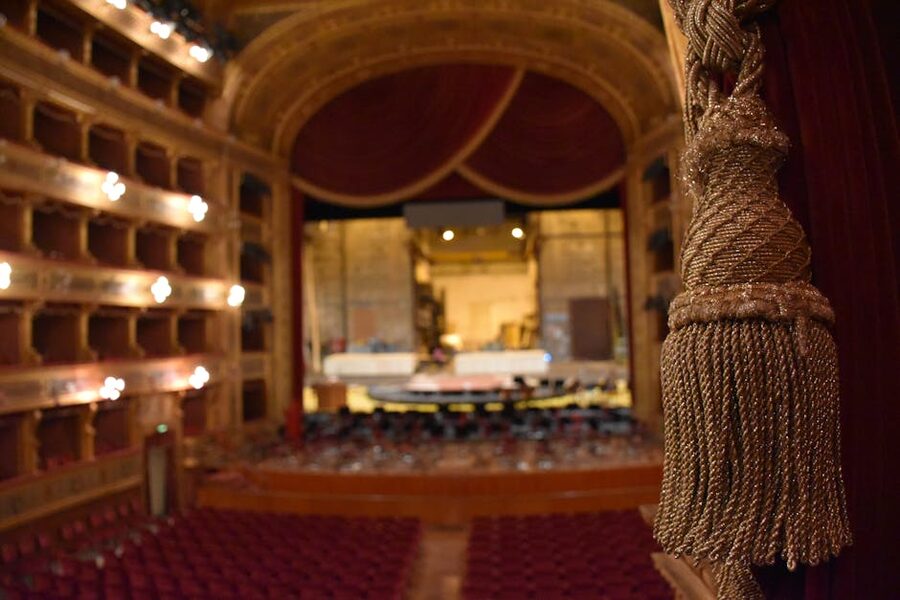 Classic theater interior with multiple balconies and ornate detail