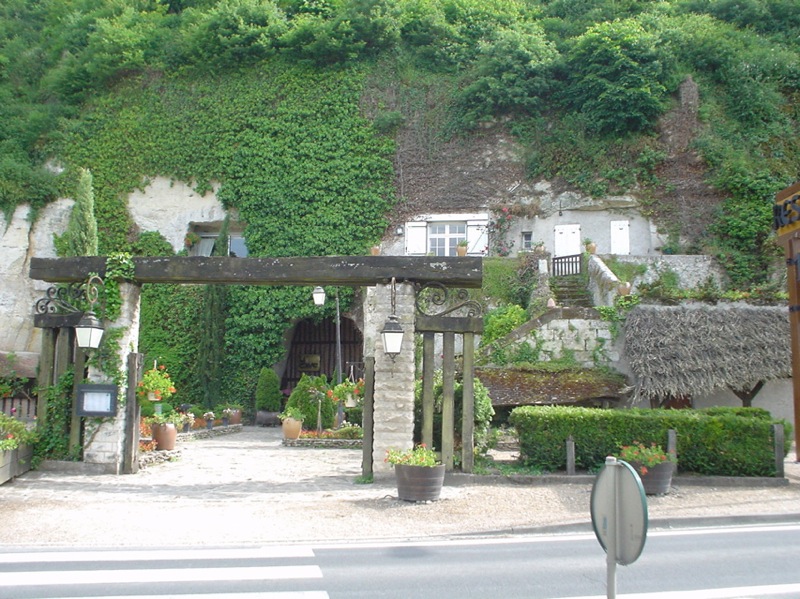 Wine bottles aging in a small Vouvray producer cave cellar