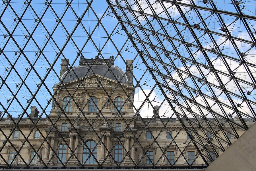 View of the Louvre Palace from inside the glass pyramid