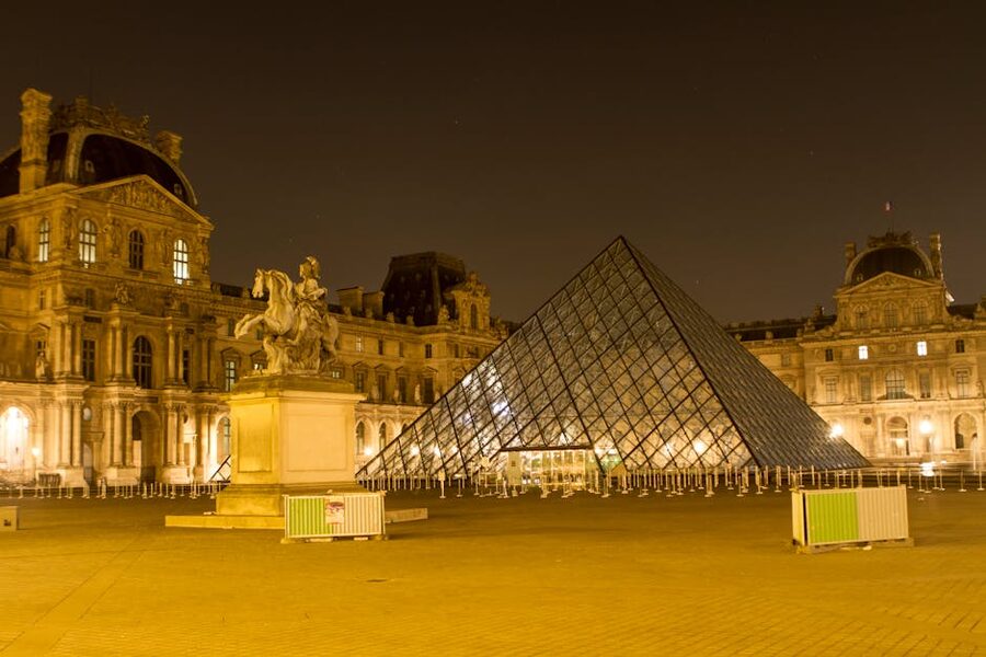 Louvre Pyramid illuminated at night Paris
