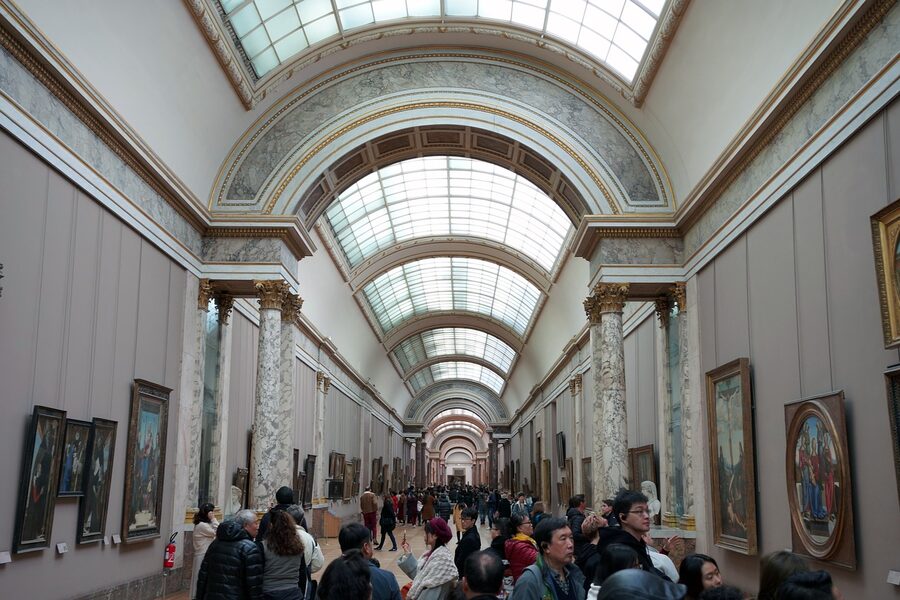 Louvre interior painting gallery with framed art on the walls