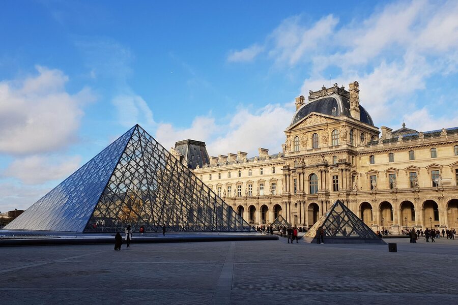 The glass pyramid and Louvre architecture in Paris