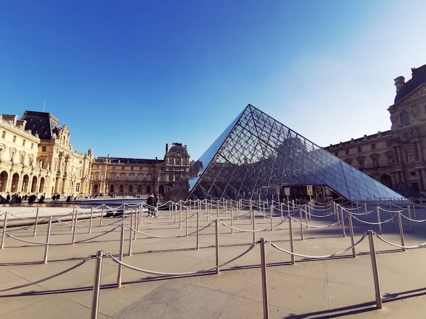 Stanchions and queue lines in front of the Louvre pyramid