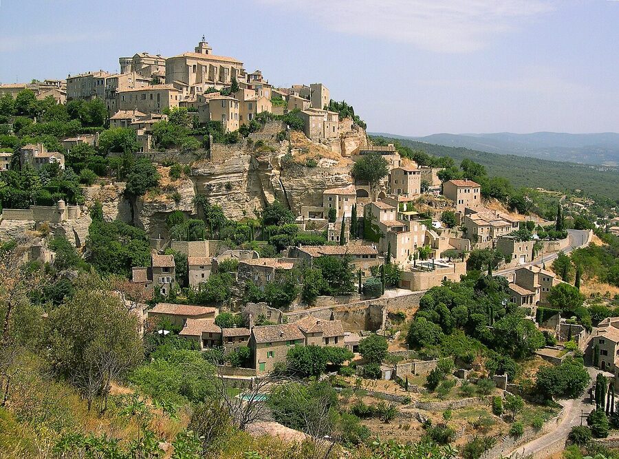 Wide panorama of Gordes village stacked on its hillside