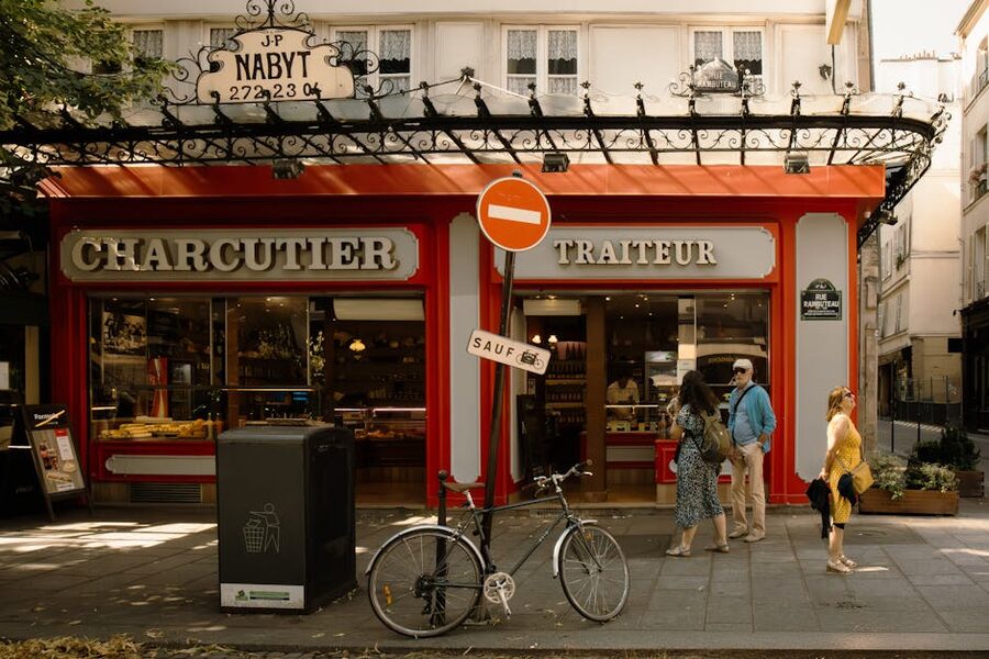 Charming Parisian street scene with charcuterie shop in Le Marais