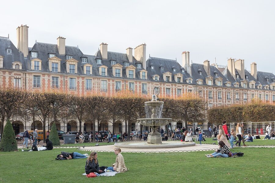 Place des Vosges arcade in Paris Marais with classical architecture