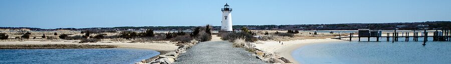 Edgartown Lighthouse on Martha's Vineyard with boats in harbor