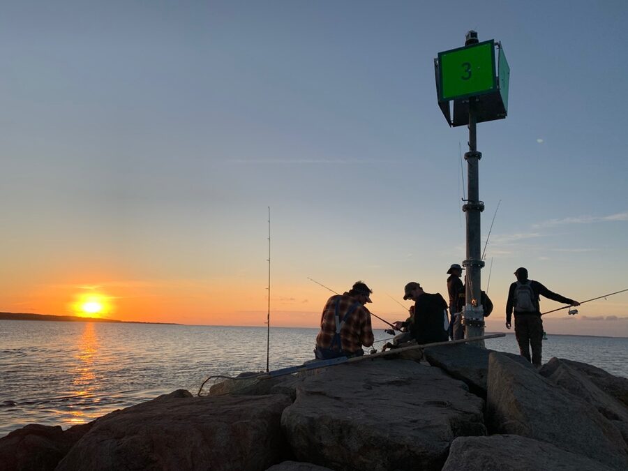 Sunset at Menemsha Harbor with fishermen on Martha's Vineyard