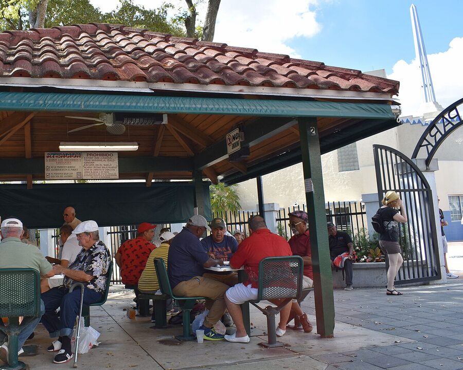 Men playing dominoes at Máximo Gómez Park in Little Havana Miami
