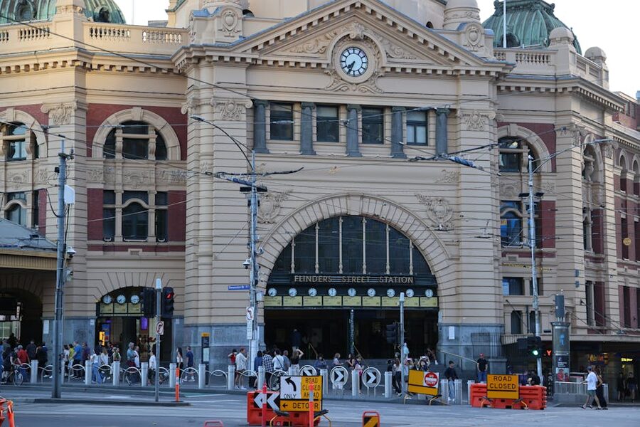 Flinders Street Station bustling with people and trams