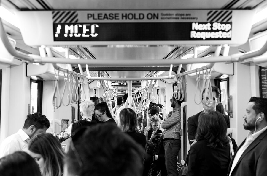 Melbourne tram with passengers boarding at a stop