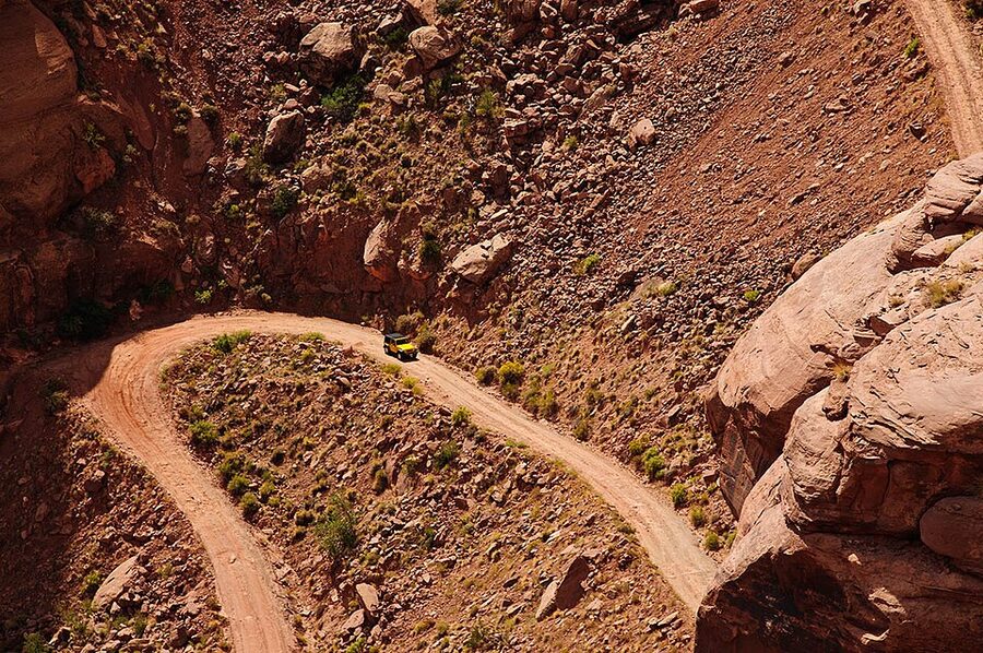 Moab jeep tour crossing a slickrock fin