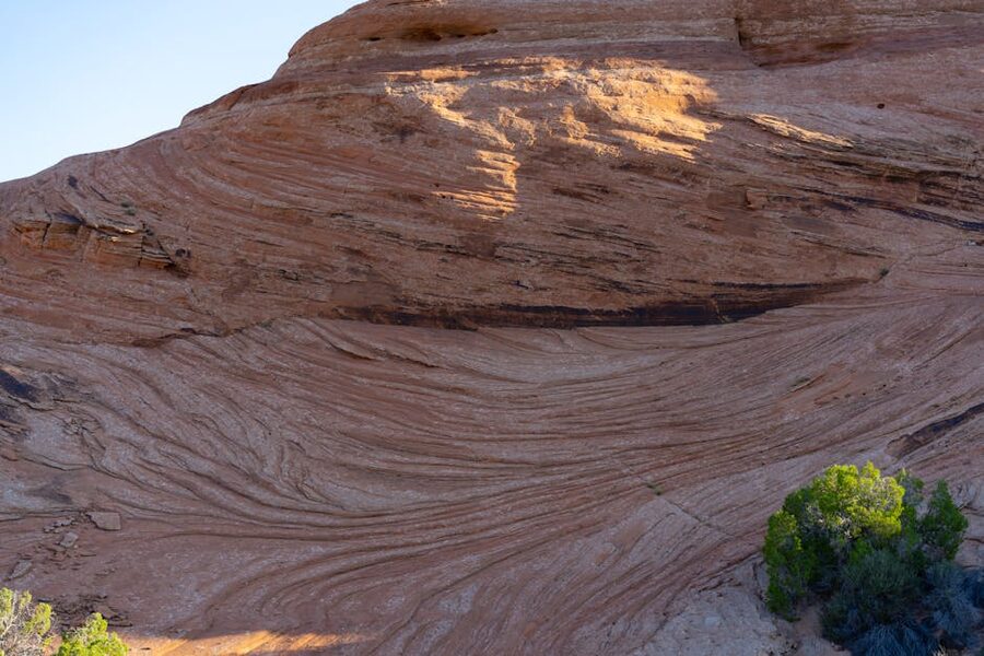 Layered red rock slickrock formations in Moab Utah