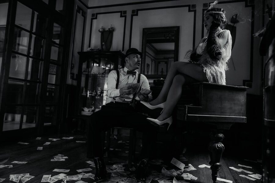 Retro black and white scene with man and woman surrounded by cash