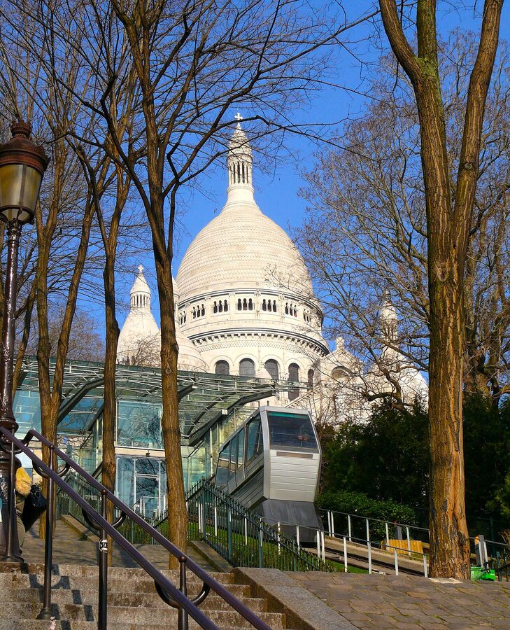 Montmartre funicular in front of Sacre Coeur basilica Paris